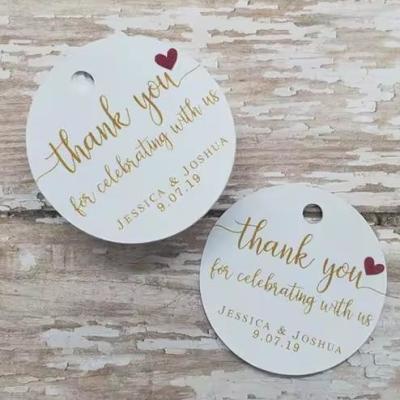 China Luxury Hangtag Labels Embossed Matte Finish Hot Stamping Business Card Tags for sale