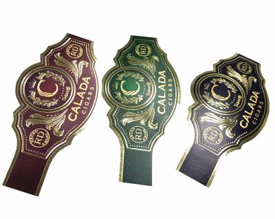 China Custom Label Sticker Hot Sale Cigar Label Sticker Embossing Printed Unique Shape UV Gold Cigar Ring Label Adhesive Waterproof Cartoon Label Printing Sticker for sale