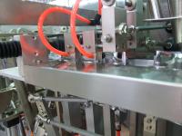 China EM130 Automatic Bag Packing Machine 30-70bags/Min Speed 1500KG Weight for sale