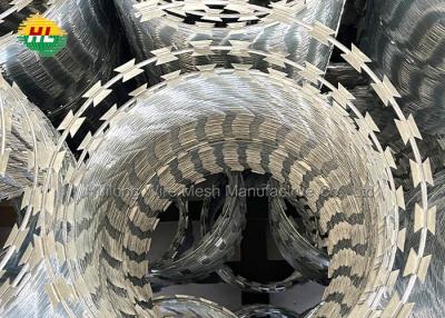 China 1.1m Hot Selling Hot Dipped Galvanized Steel Egoza Coil  Bto-18 Roll Concertina Razor Barbed Wire for sale