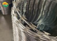 China HUILONG Razor Sharp Barbed Wire , SS Razor Barbed Tape Hot Dipped Galvanized for sale