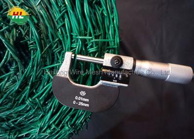 China Green Vinyl Coated Double Twist Barbed Wire As Defending Barrier for sale