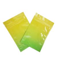 China Custom Design Glossy Green Yellow Gradient Color Flat Zipper Pouch with Foil Lined for Food Packaging for sale