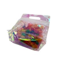China Custom Pink Radiant Holographic Color Stand Up Bags with Zipper and Handle Hole for Food Accessories Packaging for sale