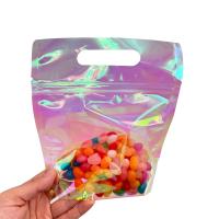 China Custom Pink Radiant Holographic Color Stand Up Bags with Zipper and Handle Hole for Food Accessories Packaging for sale