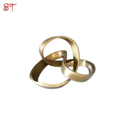 China Golden Silk Ribbon Resin Statue Abstract Home Accessories Decorative Metal Gifts Ornament Landscape Art Indoor Statues for sale