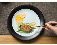 China Reactive Glaze Embossed Dinnerware Set Round Matt Black 12 Piece Ceramic Tableware for sale