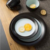 China Reactive Glaze Embossed Dinnerware Set Round Matt Black 12 Piece Ceramic Tableware for sale
