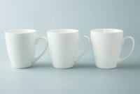 China 12oz 350ml Embossed New Bone China Coffee Mug with Ergonomic Handle for sale