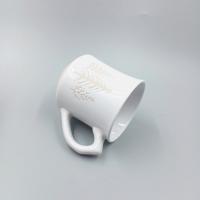 China Promotional 460ml White Embossed Ceramic Mug ODM Customizable for Milk Coffee for sale