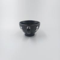 China 9oz Bright Black Glazed White Relief Ceramic Cup Coffee Tea Cup for sale