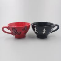 China 9oz Bright Black Glazed White Relief Ceramic Cup Coffee Tea Cup for sale