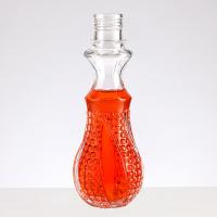 China Glass Small Wine Bottle with Embossed Engraved Mini Liquor Decanter Stopper Lid 50ml 100ml for sale