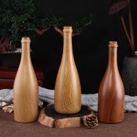 China Custom Size Accepted 750ml/350ml Wooden Pattern Glass Bottle for Beer Water Champagne for sale