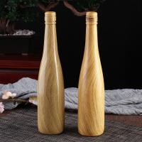 China Custom Size Accepted 750ml/350ml Wooden Pattern Glass Bottle for Beer Water Champagne for sale