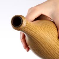 China Custom Size Accepted 750ml/350ml Wooden Pattern Glass Bottle for Beer Water Champagne for sale