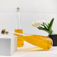 China Customized Shape Mineral Packaging Glass Bottles with Cork Supply Bulk Sale 330ml 520ml for sale