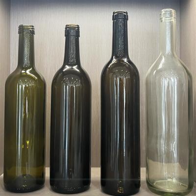 China Industrial Beverage 750ml Clear Round Bordeaux Red Fruit Wine Bottles with Cork Caps for sale