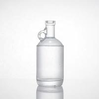 China Sturdy Base 750ml Glass Vodka Whiskey Bottle with Handle and Customization Service for sale