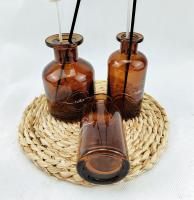 China Clear Glass Collar 100ml 150ml Empty Luxury Round Amber Reed Diffuser Bottle for Liquor for sale