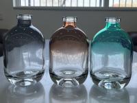 China 250ml 375ml 500ml Thick Bottom Glass Whiskey Bottle with Customized Clear Round Design for sale