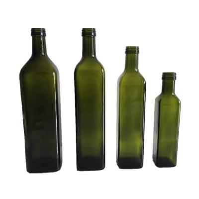 China Empty 750ml Olive Green Round Glass Wine Bottle with Cork Hot Stamping Surface Handling for sale