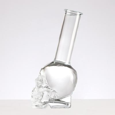 China Clients' Specific Requirements Transparent Glass Bottles with Skull Shaped Long Neck for sale