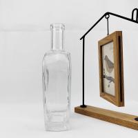 China Eco-friendly Glass Body 750ml Glass Wine Bottle with Lid in Unique Design Shape for sale