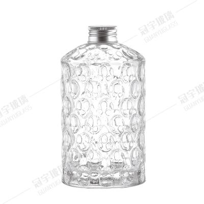 China Custom Logo Acceptable Concave And Convex Glass Bottle at Direct Chinese for Decorative for sale