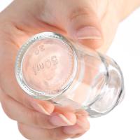 China 30ml Mini Round Glass Bottle with Maple Leaf Pattern Capacity 30ml Sealing Type Crown Cap for sale