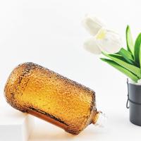 China 750ml Brown Glass Wine Bottle with Textured Surface Body Material Glass Clear Empty for sale