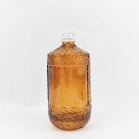 China 750ml Brown Glass Wine Bottle with Textured Surface Body Material Glass Clear Empty for sale