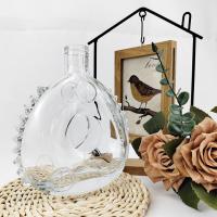 China Special Craftsmanship Brandy Bottle Unique Flat Round Design with Crystal Flower Shape for sale