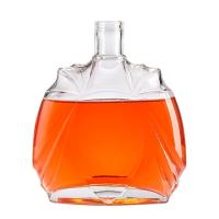 China Eco-friendly Glass Body Brandy Bottle Flat Transparent Glass Bottle for XO Brandy for sale