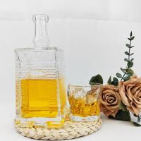 China 680ml Square Glass Vodka Bottle with Engraved Design Customized Spirit Bottle for sale