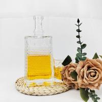 China 680ml Square Glass Vodka Bottle with Engraved Design Customized Spirit Bottle for sale