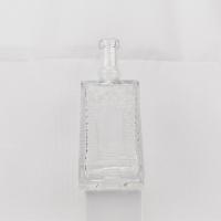 China 680ml Square Glass Vodka Bottle with Engraved Design Customized Spirit Bottle for sale