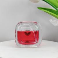 China Glass Body Material 100ml Unique Empty Perfume Bottle with Sprayer and Cork Cap for sale