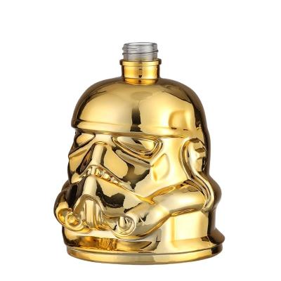 China Creative Golden Skull Vodka Shot Whiskey Decanter Glass Bottle with Screw Cap 200ml for sale