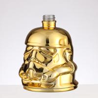 China Creative Golden Skull Vodka Shot Whiskey Decanter Glass Bottle with Screw Cap 200ml for sale