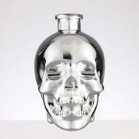 China Creative Golden Skull Vodka Shot Whiskey Decanter Glass Bottle with Screw Cap 200ml for sale