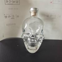 China Hot Stamping Surface Handling Glass Skull Bottle with Stopper 700ml 750ml Transparent for sale