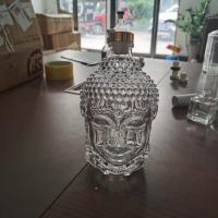 China Hot Stamping Surface Handling Glass Skull Bottle with Stopper 700ml 750ml Transparent for sale