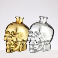 China Cap with Brush Seal Transparent Gold and Silver Skull Glass Whisky Vodka Wine Bottle for sale