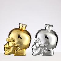 China Cap with Brush Seal Transparent Gold and Silver Skull Glass Whisky Vodka Wine Bottle for sale