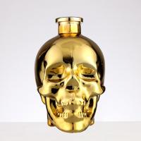 China Rubber Stopper Skull Shape Glass Bottles Golden Electroplate Luxury Wine Customized Logo for sale