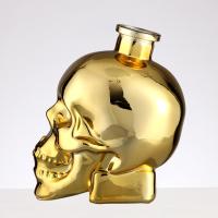 China Rubber Stopper Skull Shape Glass Bottles Golden Electroplate Luxury Wine Customized Logo for sale