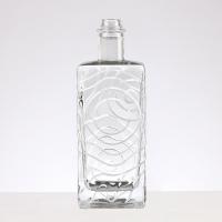 China Embossed Square Wine Glass Bottle With Glass Lid Wine Hot stamping Water wave pattern for sale