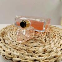 China Acceptable Customer's Logo Glass Perfume Bottle with Customized Lid 30ml 50ml 100ml for sale