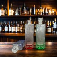 China 500ml 700ml Round Shape Glass Whiskey Bottle for Mountain Wine Vodka and Gin Customized for sale
